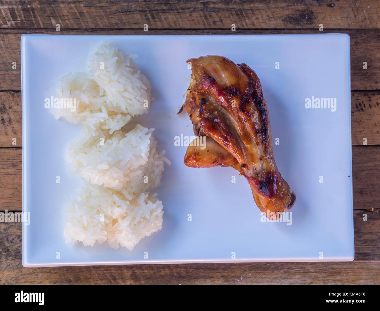 Grilled Chicken Drumstick with sticky rice Stock Photo - Alamy