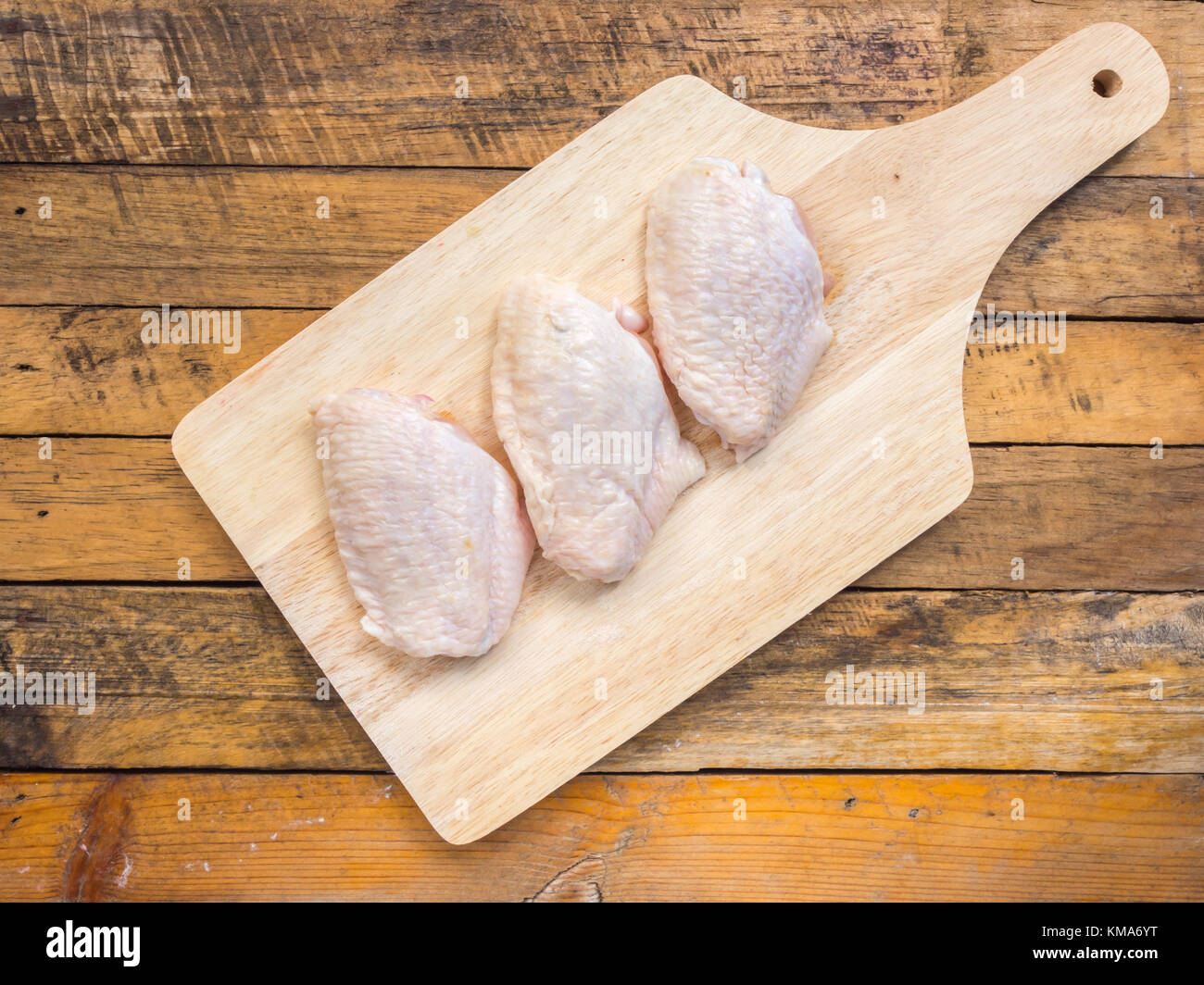 chicken middle wing on wood block Stock Photo - Alamy