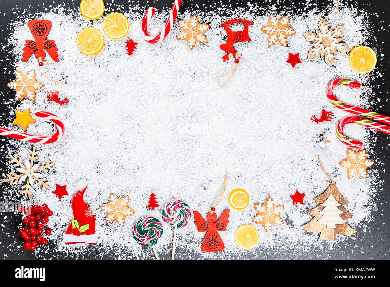 Christmas background with gingerbread snowflakes, white snow, toys ...