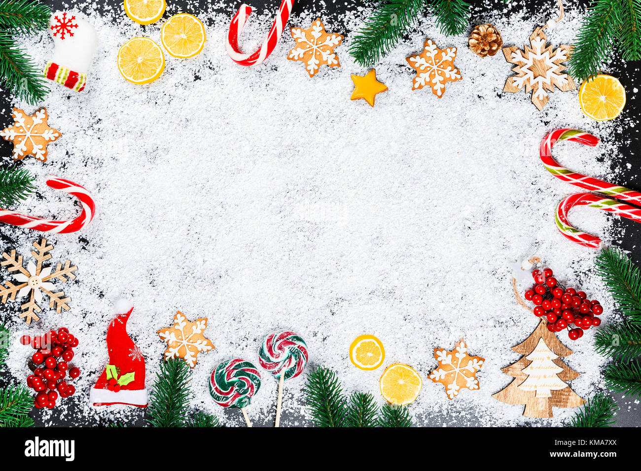 Christmas background with gingerbread snowflakes, white snow, toys ...