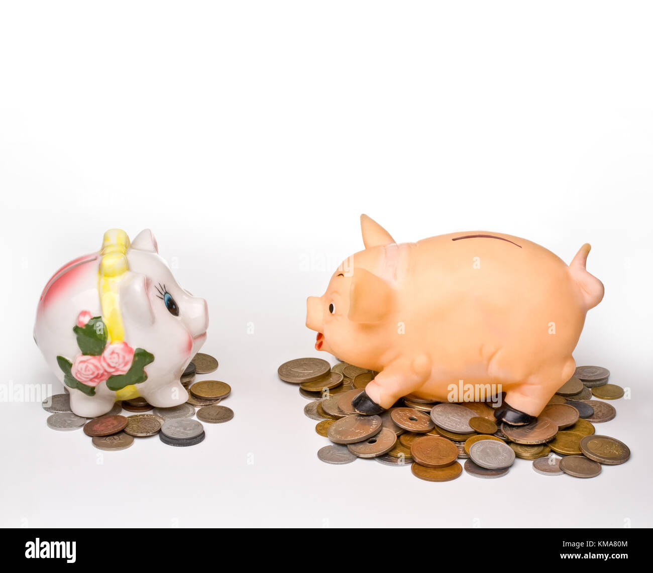 conversation of two piggy banks on a light background Stock Photo - Alamy