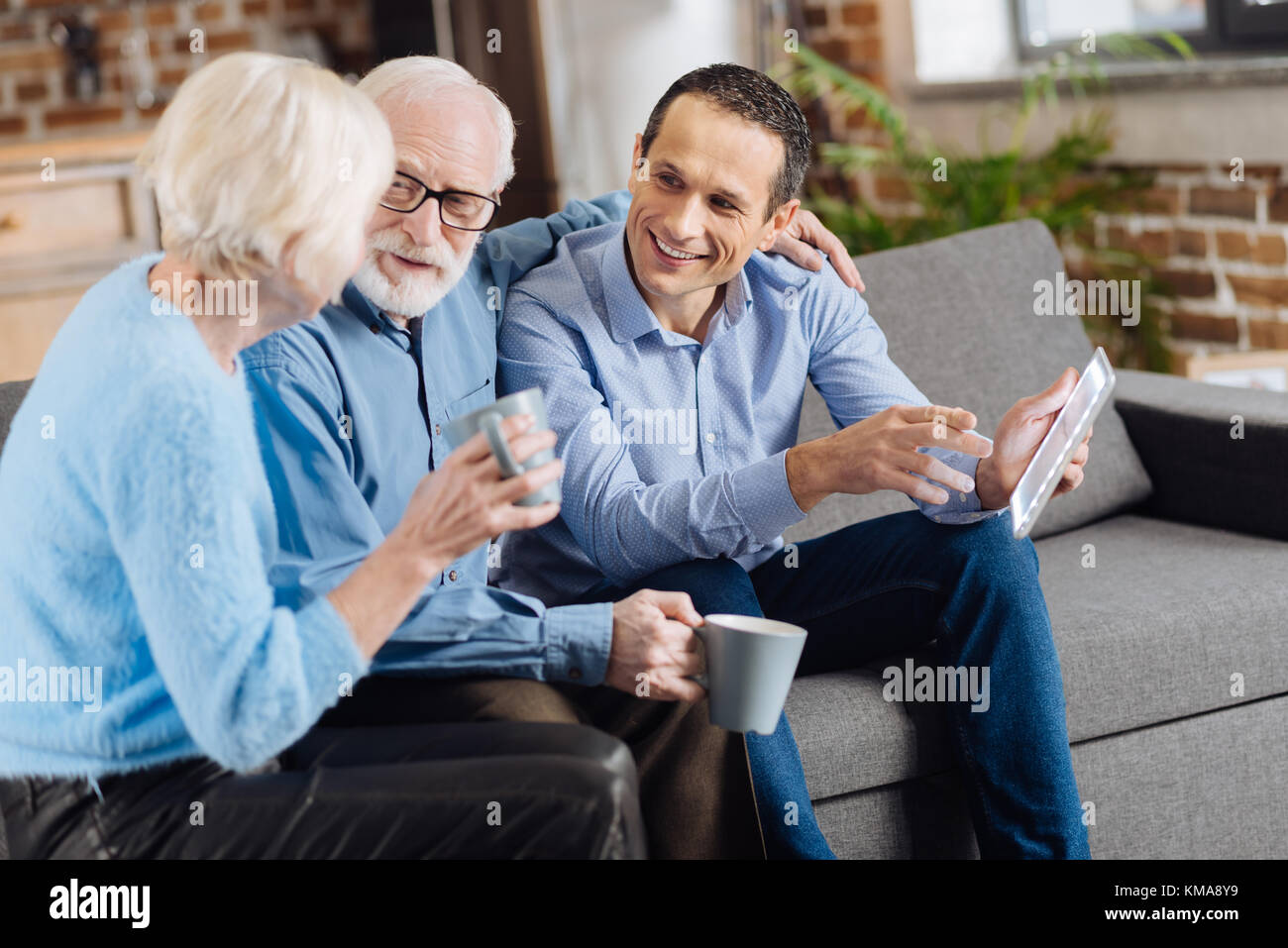 Happy family chatting hi-res stock photography and images - Alamy