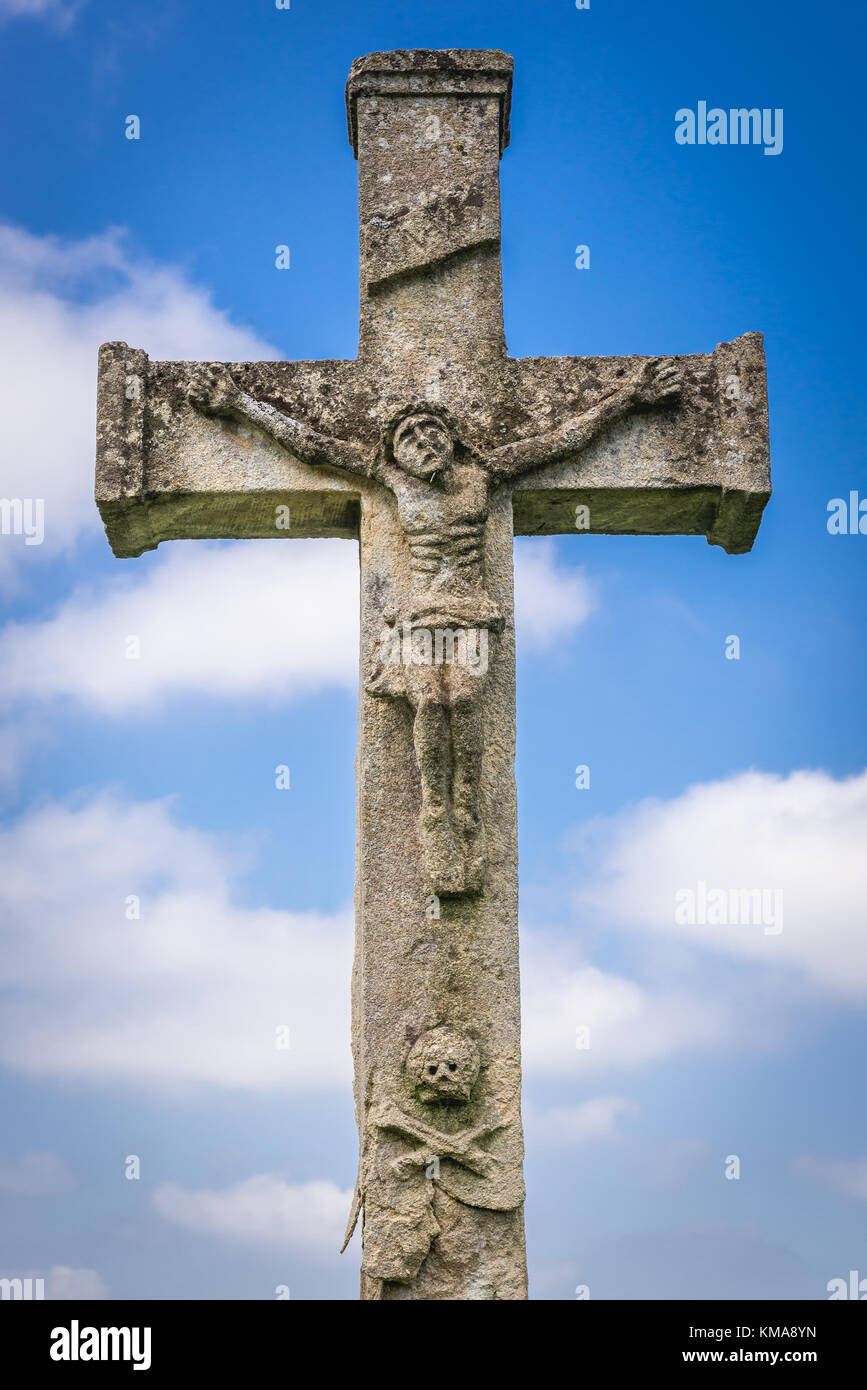 Old grave cross on a cemetery near ruined castle in former ...