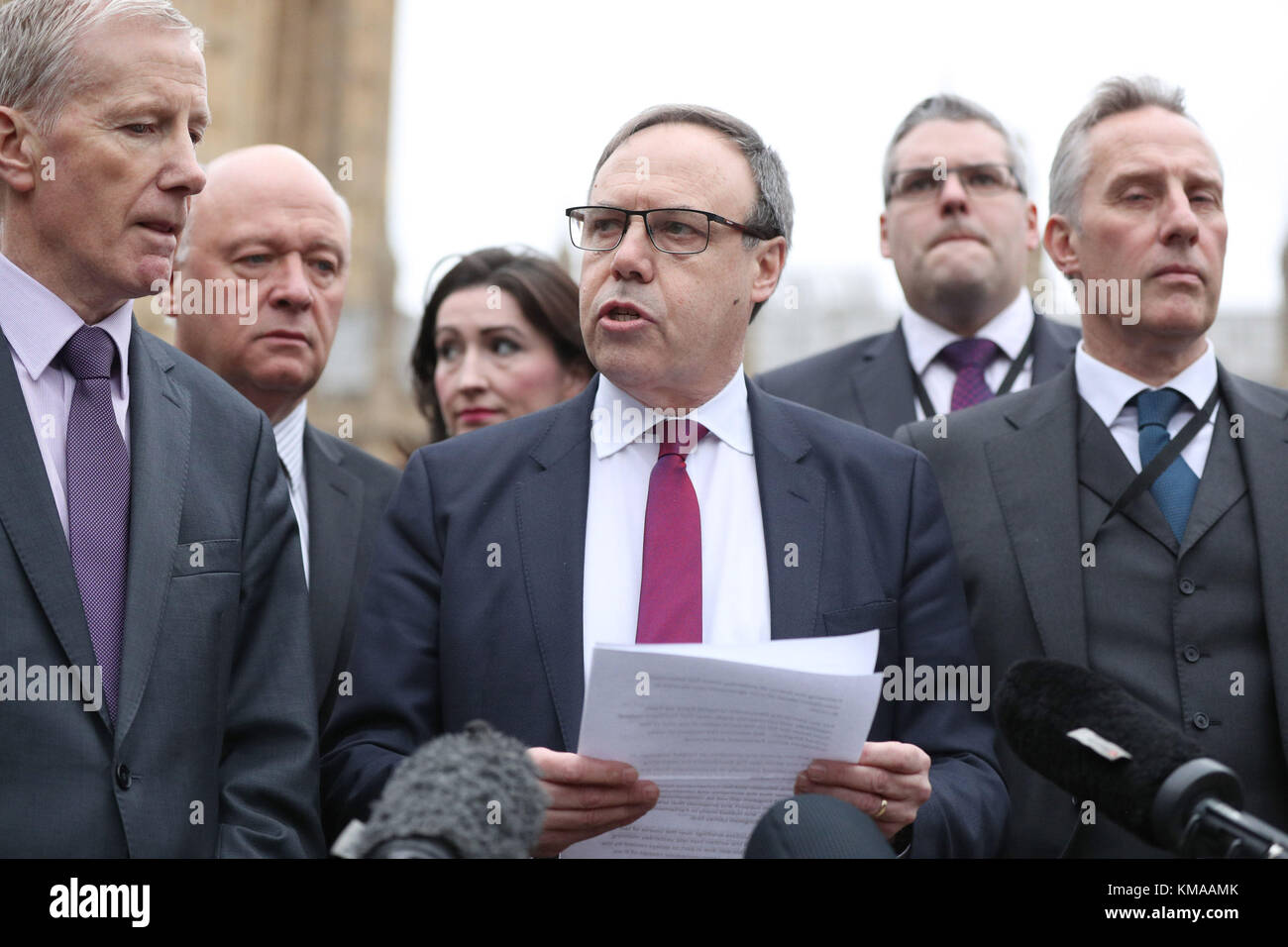 Deputy leader Nigel Dodds and fellow Westminster DUP MPs speaking in ...