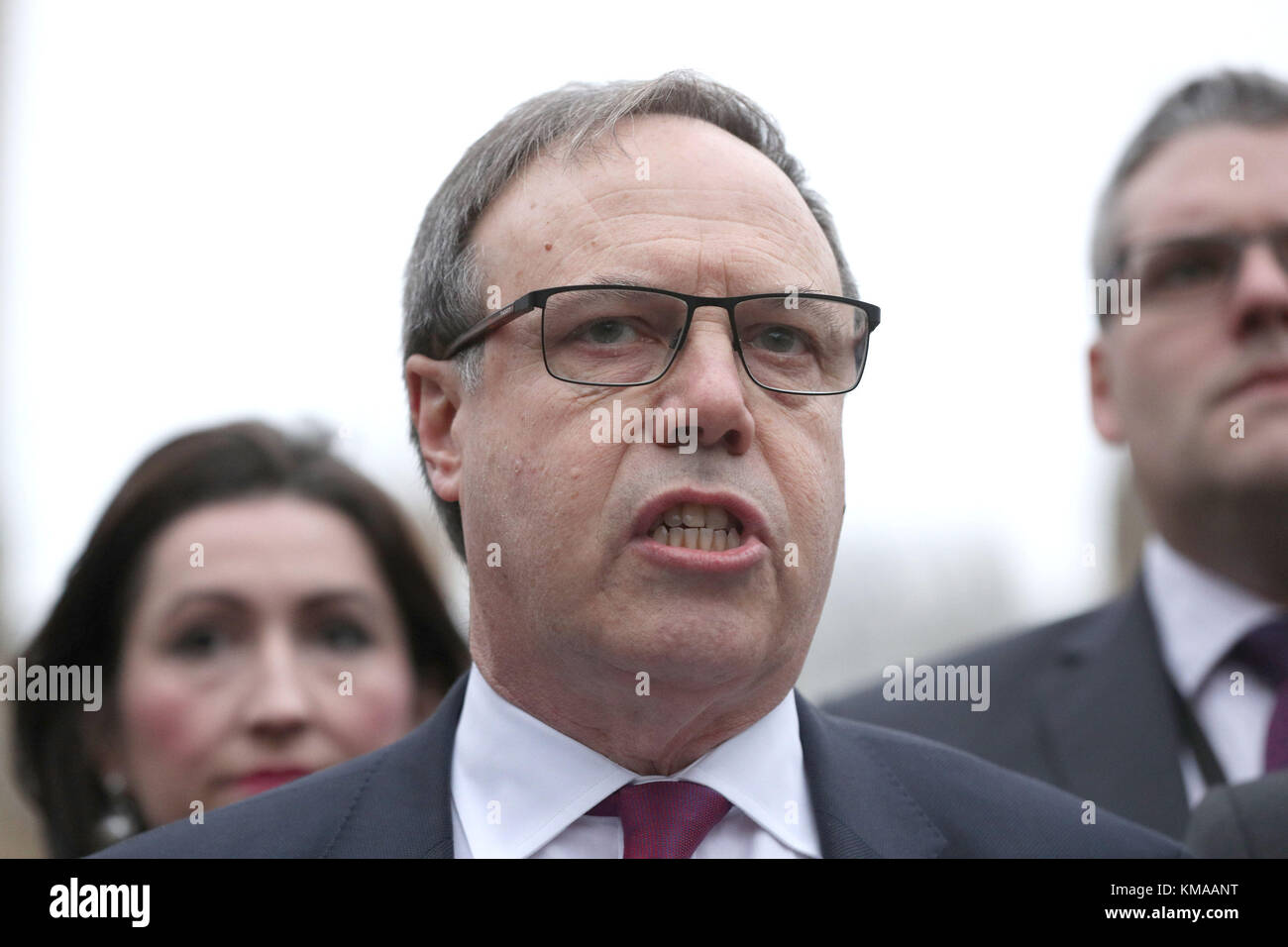 Deputy leader Nigel Dodds and fellow Westminster DUP MPs speaking in ...