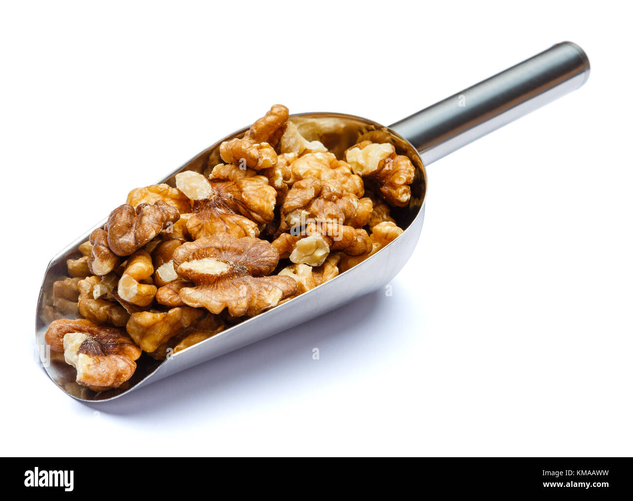 Scoop of Roasted walnuts isolated on white background. Clipping path ...
