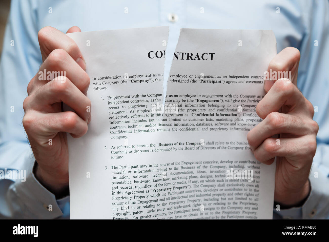 Angry businessman tearing up a document, contract or agreement Stock ...