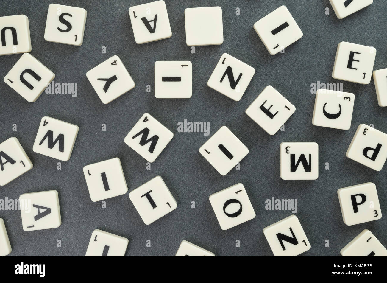 tiles with alphabet letters and numbers on a dark surface - top view ...
