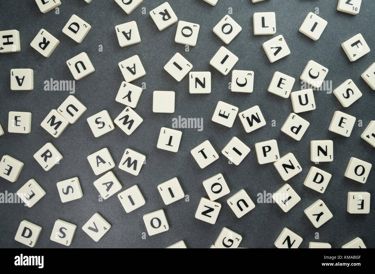 tiles with alphabet letters and numbers on a dark surface - top view ...