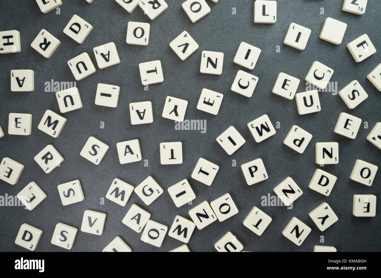 tiles with alphabet letters and numbers on a dark surface - top view ...