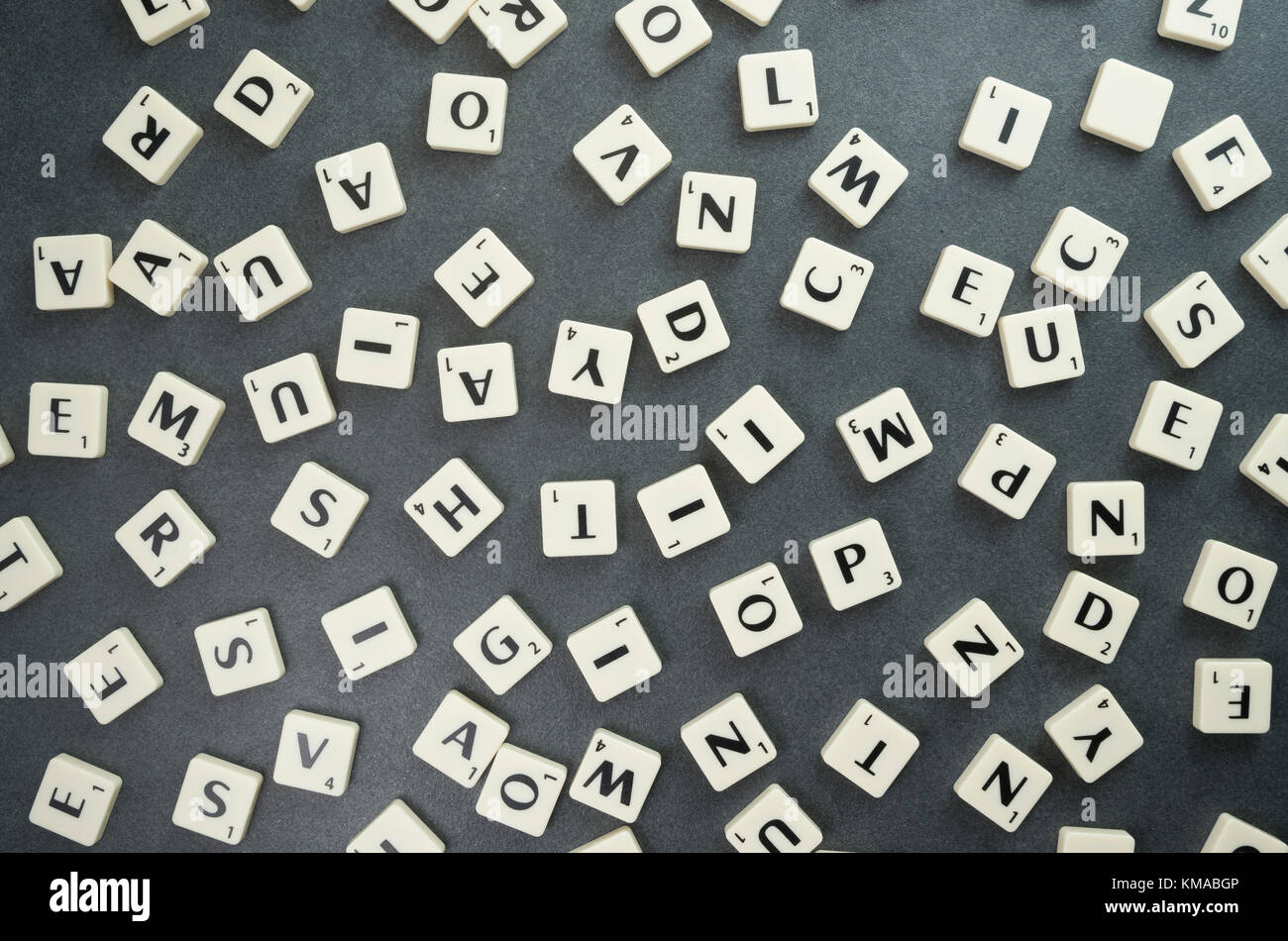 tiles with alphabet letters and numbers on a dark surface - top view ...