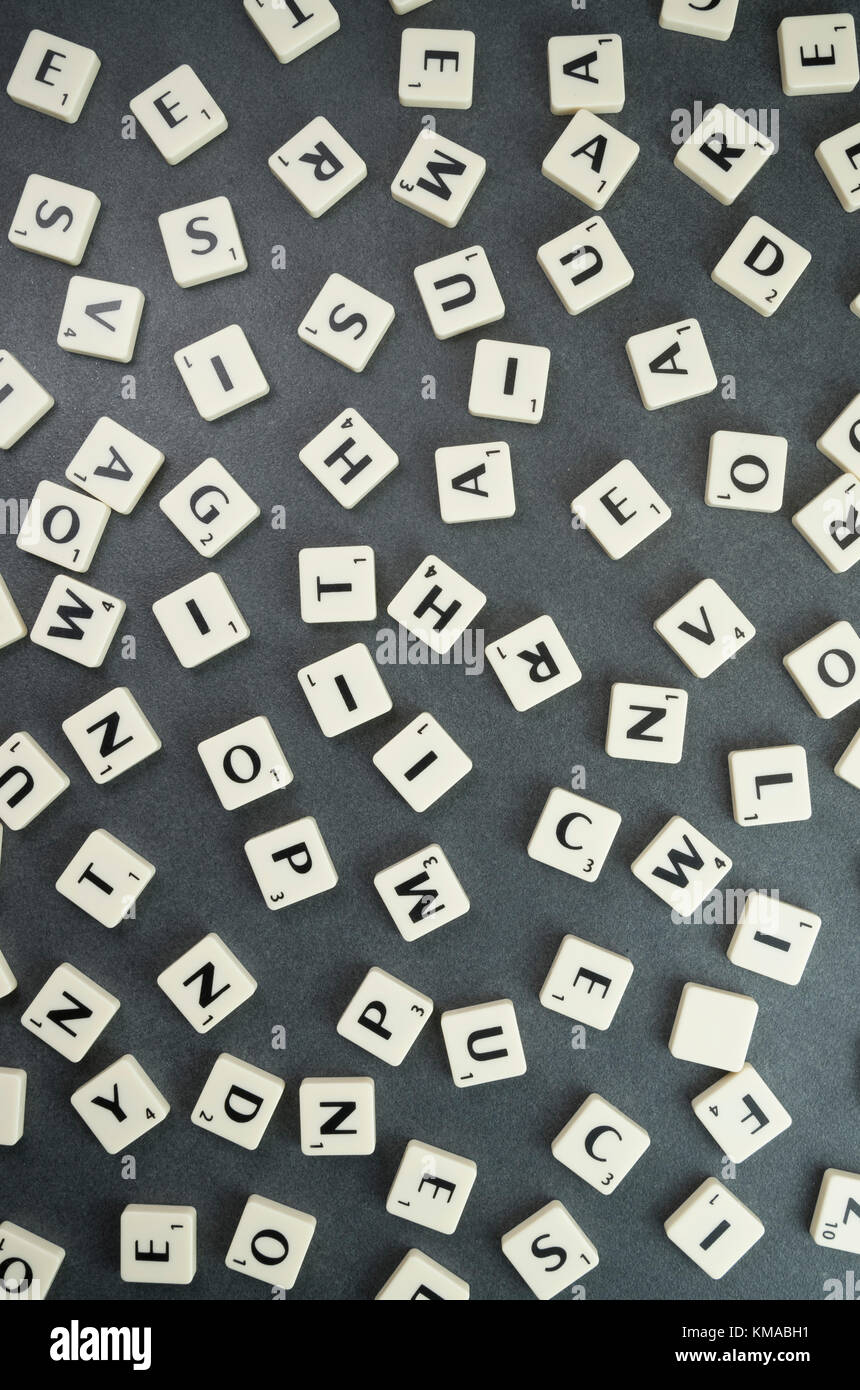 tiles with alphabet letters and numbers on a dark surface - top view ...