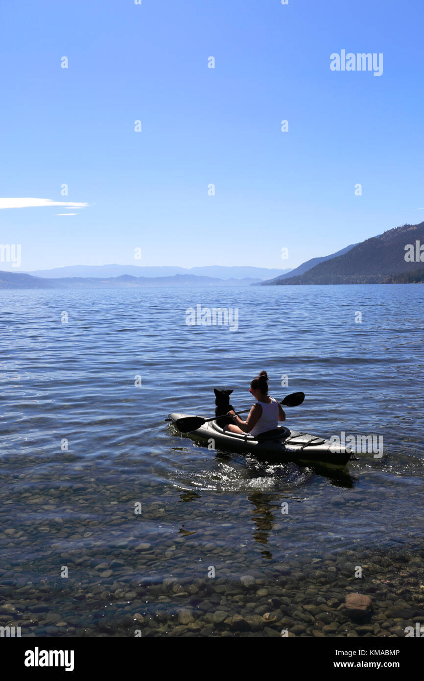 Female Canoeist on Lake Okanagan, Fintry Provincial Park, near Kelowna ...