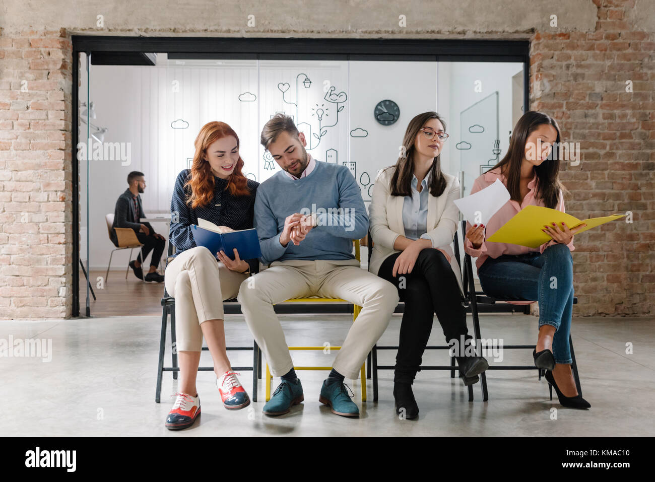 Peaking in someone else's notes in the waiting room Stock Photo - Alamy