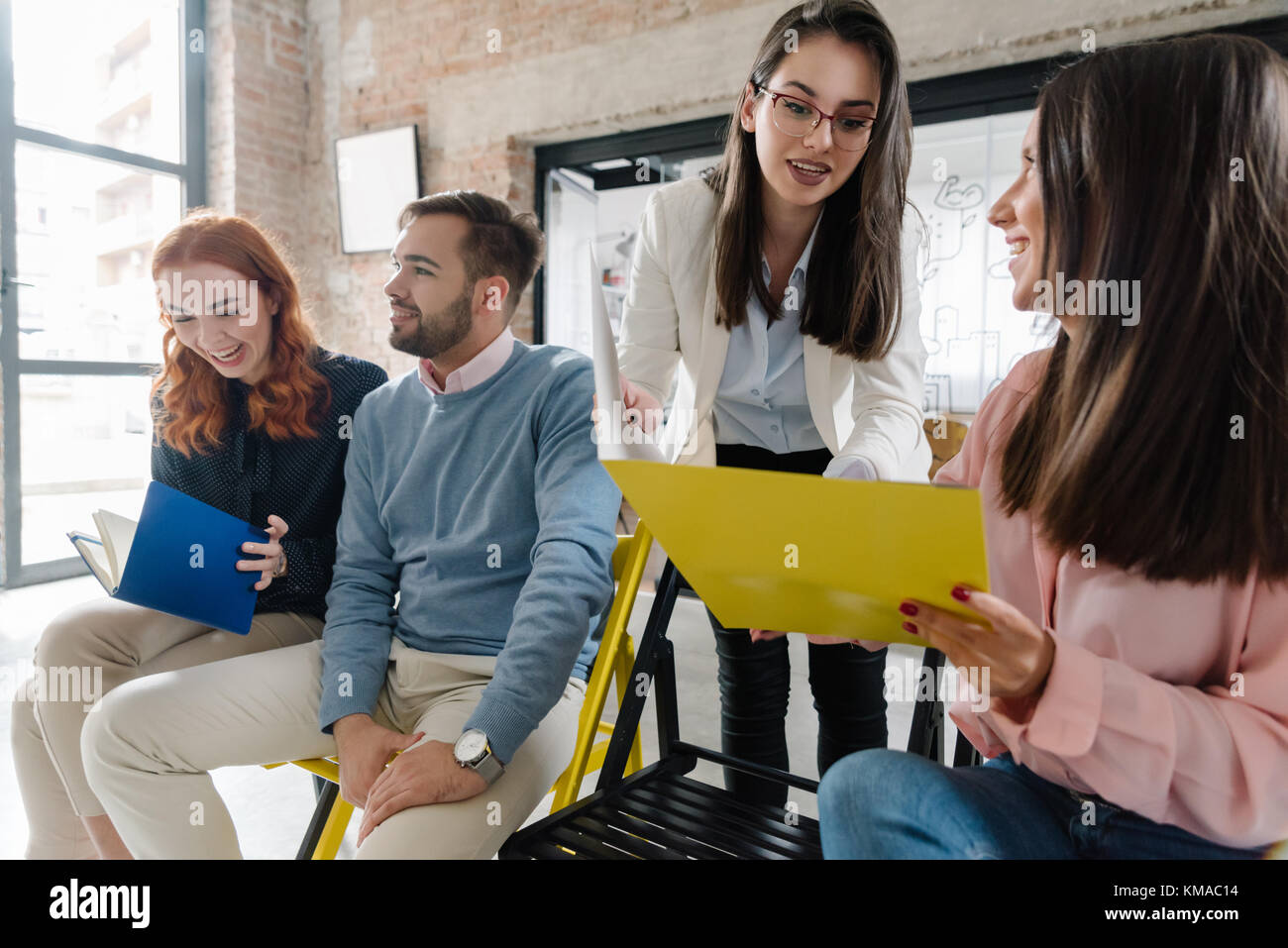 Trainees checking their documents before the interview Stock Photo - Alamy
