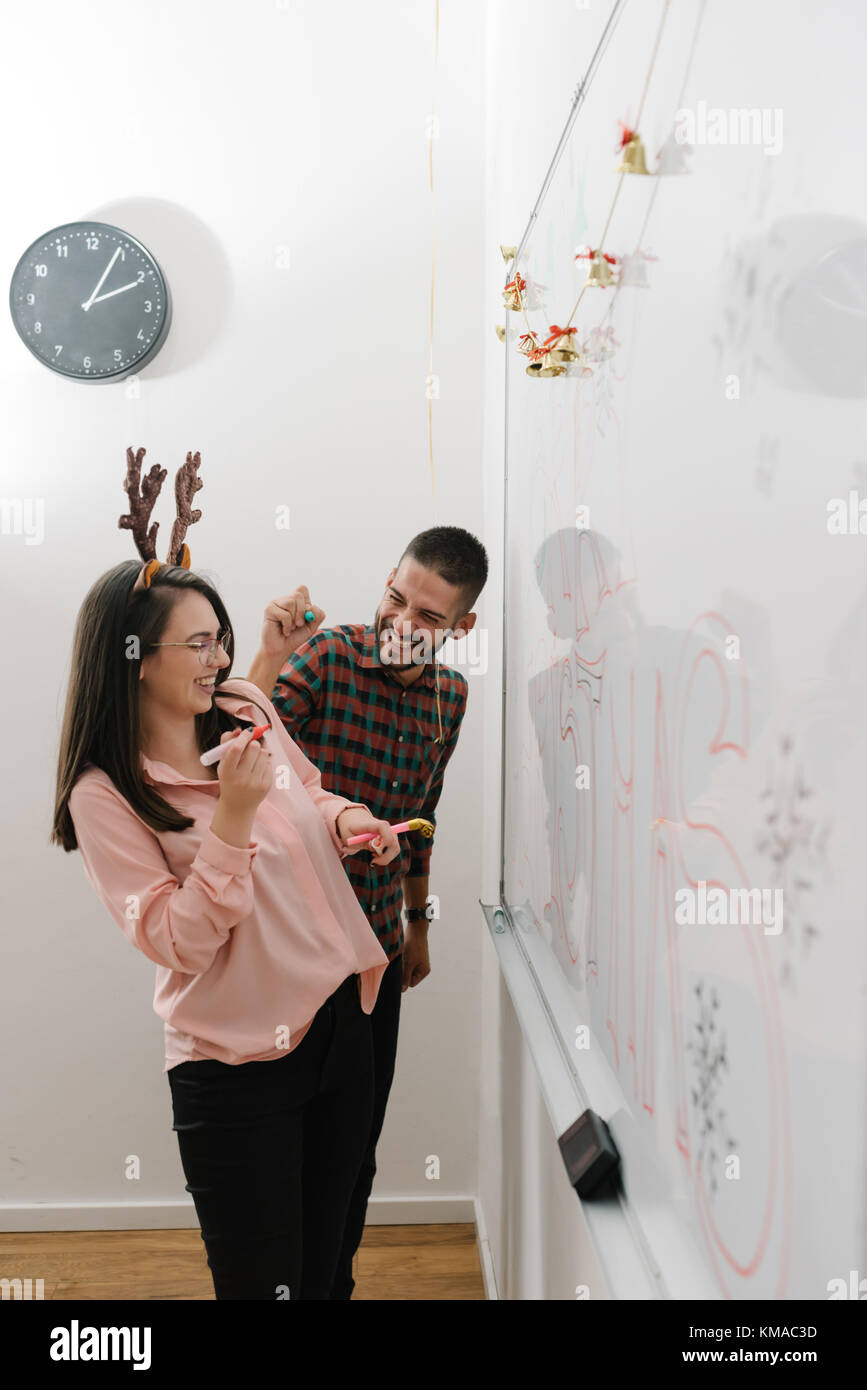 Coworkers goofing around at the office party Stock Photo - Alamy