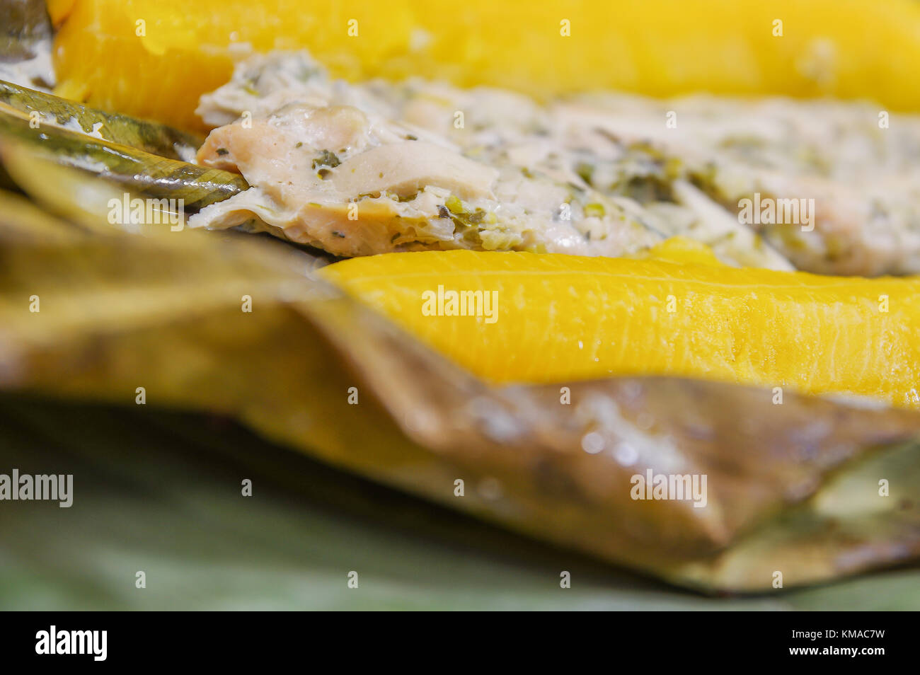 Close up of delicious typical amazonia food, fish cooked in a leaf with ...