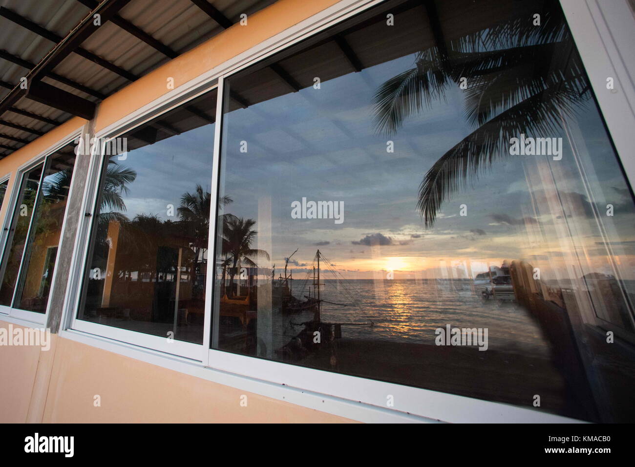 Sunset scenes reflection on window of building Stock Photo - Alamy