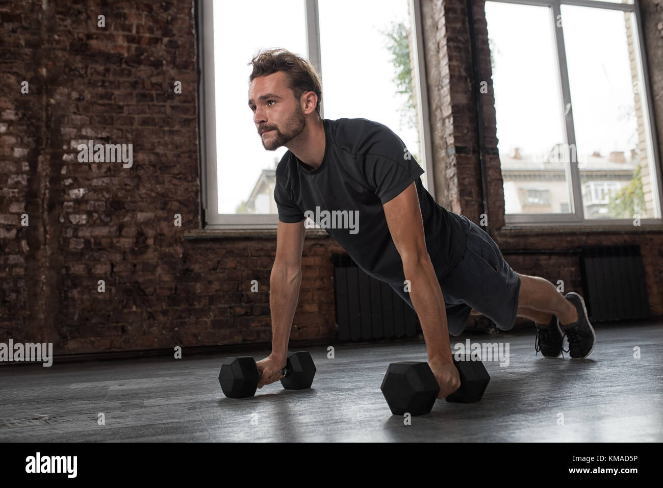 Man doing pushups at the gym Stock Photo - Alamy