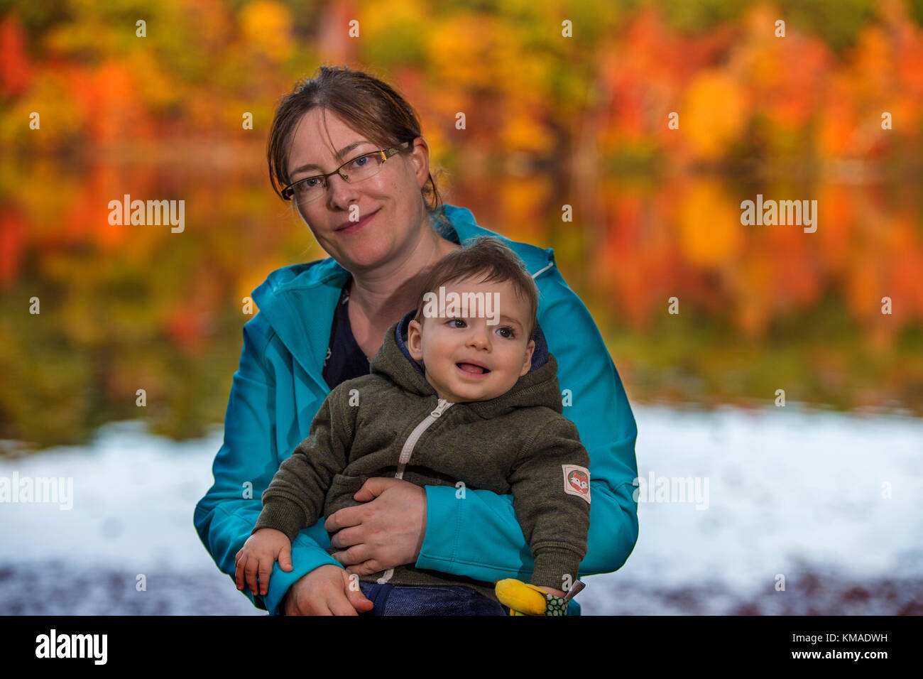 mother and baby in canadian autumn Stock Photo - Alamy