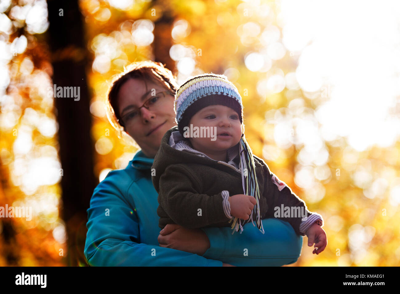 Baby boy in fall forest Stock Photo - Alamy
