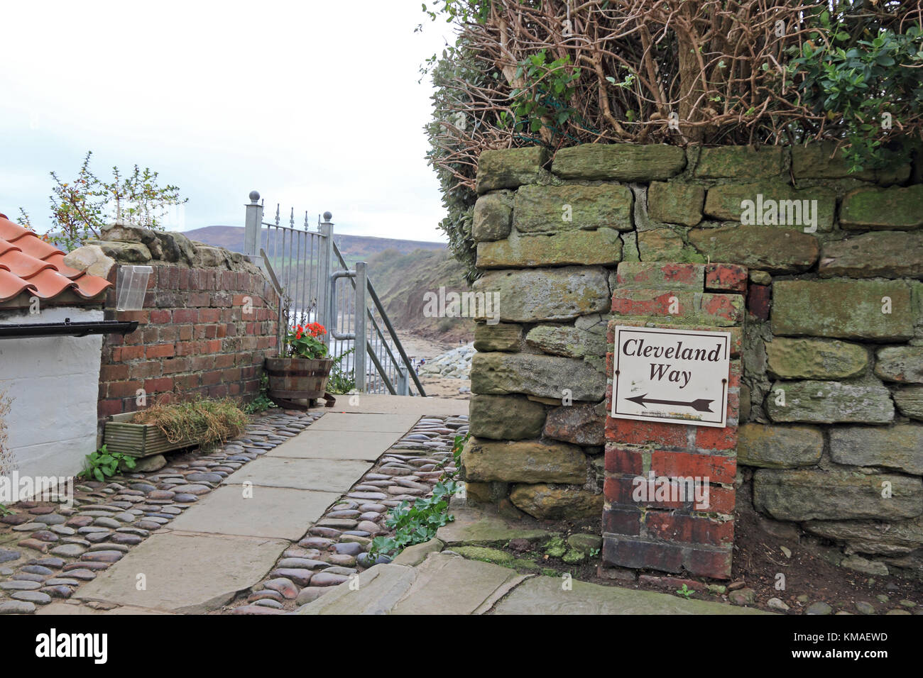 Cleveland Way sign on stone wall, Robin Hood's Bay, North Yorkshire ...