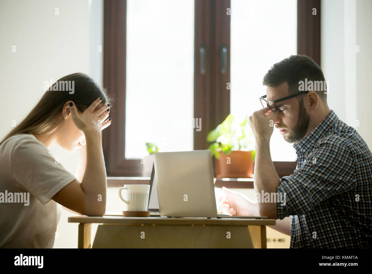 Stress at work: millennial businessman and businesswoman feeling ...