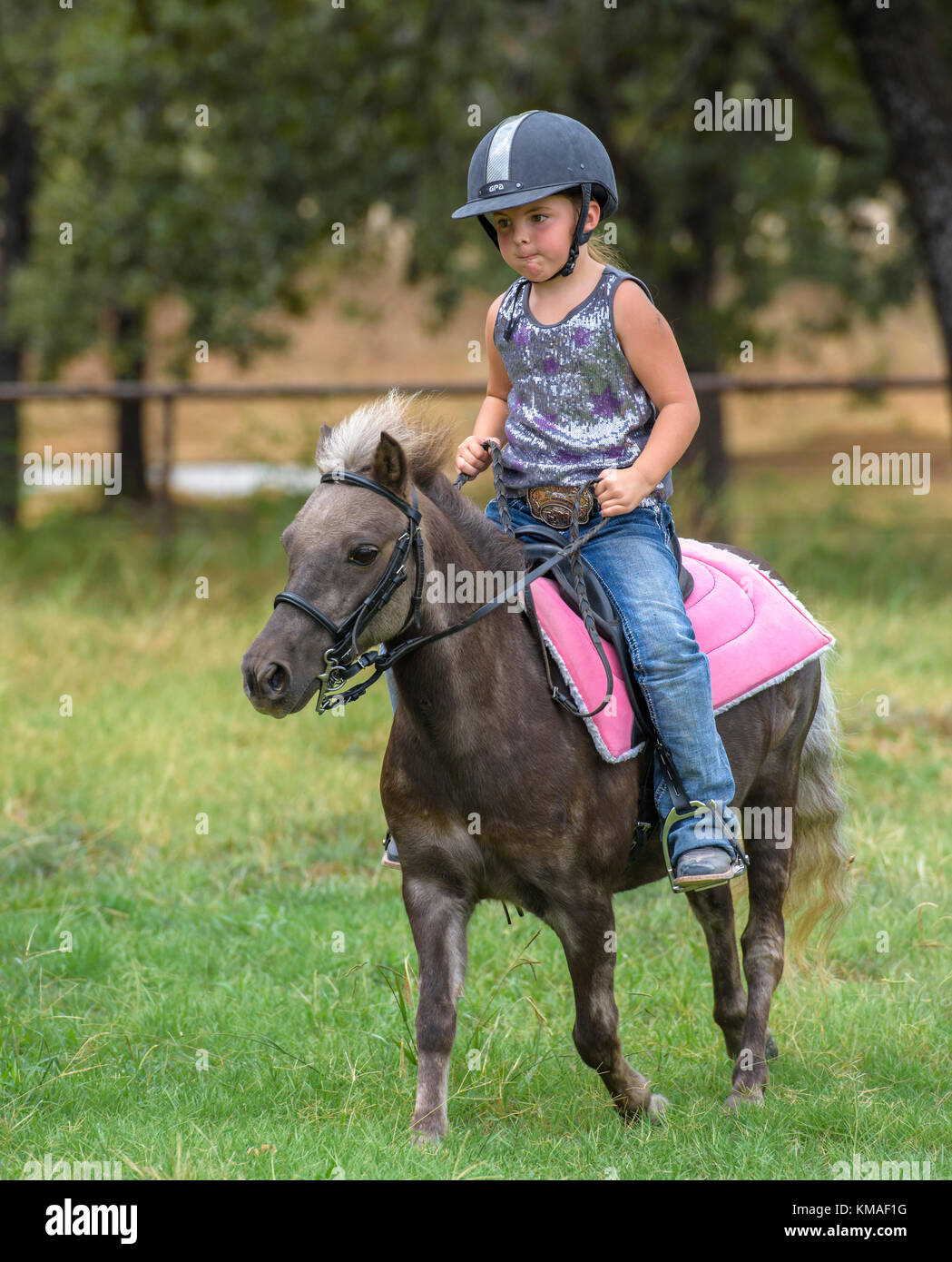 Girl riding pony hi-res stock photography and images - Alamy