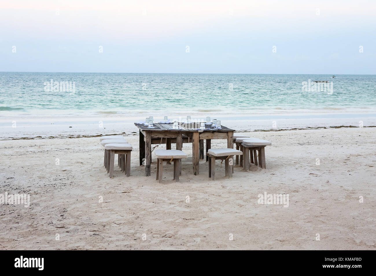 Wooden table and chairs on the beach. Furniture for lounging on Stock ...