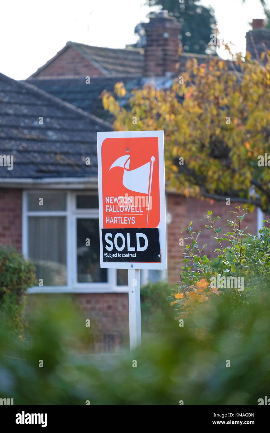 estate agents sold sign outside a house Stock Photo - Alamy