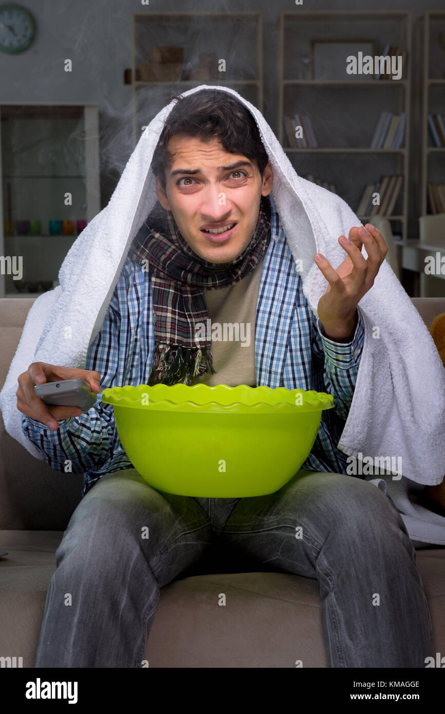 Sick man doing inhalation at night in home Stock Photo - Alamy