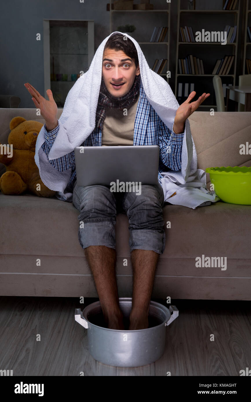 Sick man washing his feet at home Stock Photo - Alamy