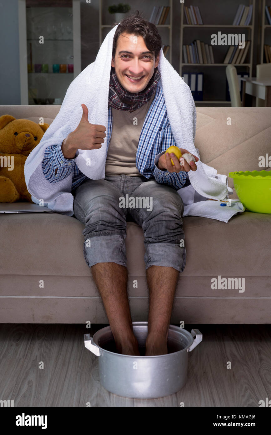 Sick man washing his feet at home Stock Photo - Alamy