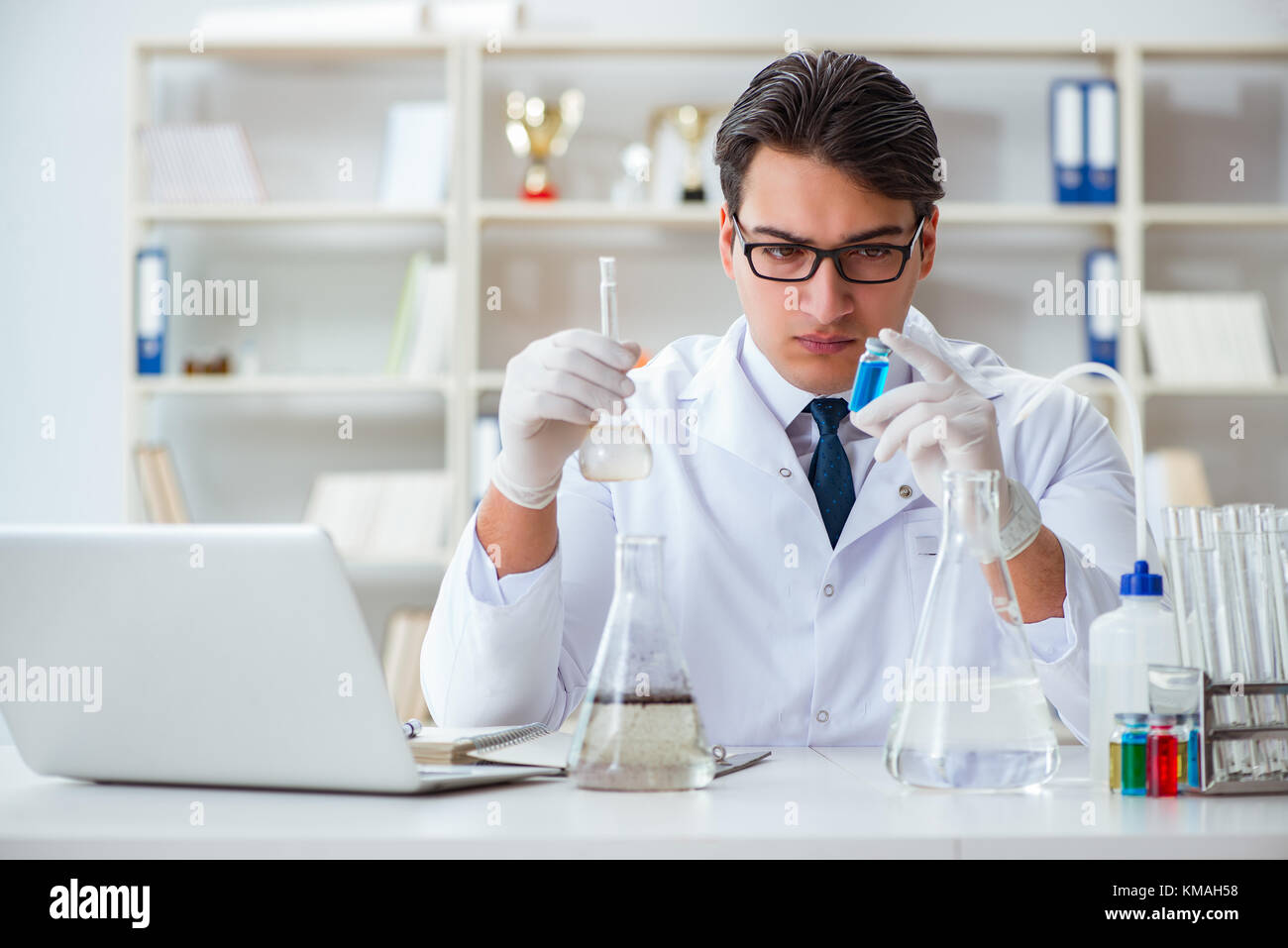 Young researcher scientist doing a water test contamination experiment ...