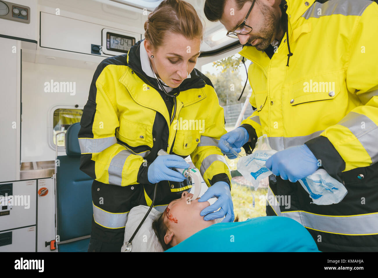 Emergency medics performing reanimation on clinically dead woman Stock ...