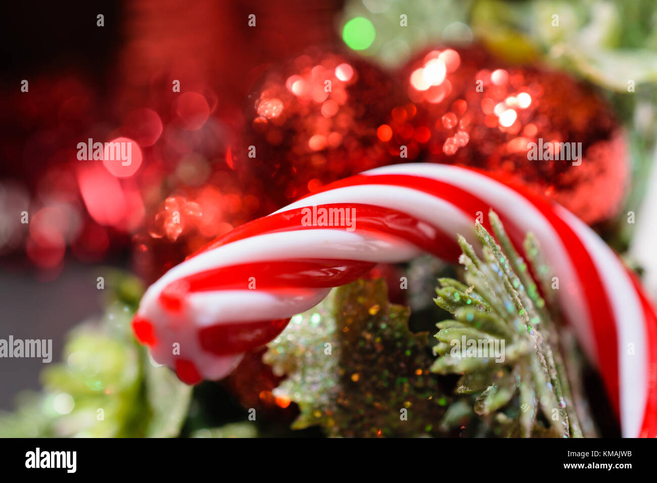 Christmas red candy cone with seasonal decor background, close up Stock ...