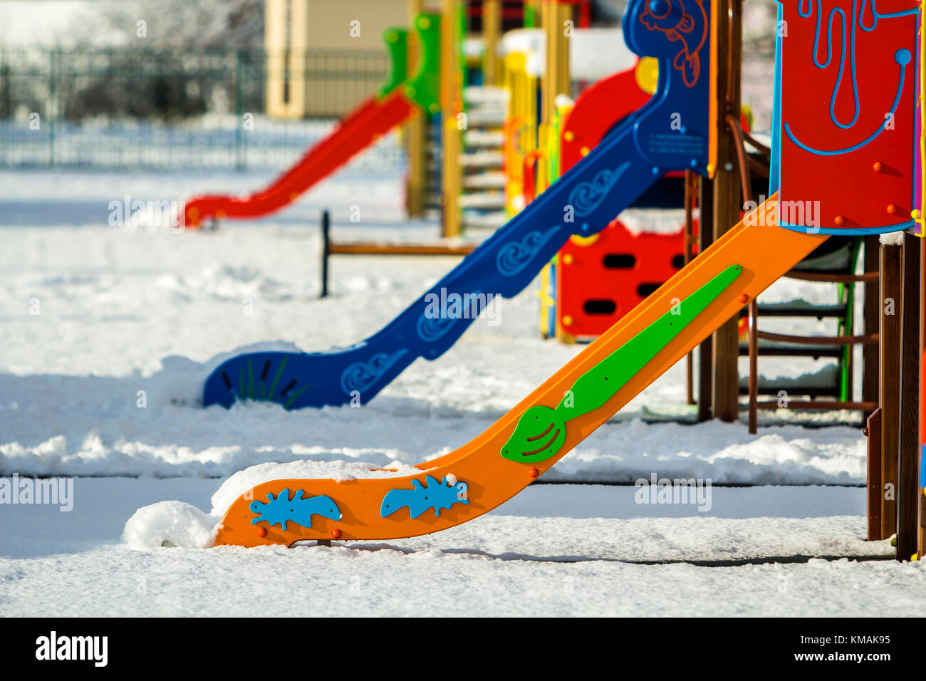 Playground in kindergarten for children in winter with snow covered ...