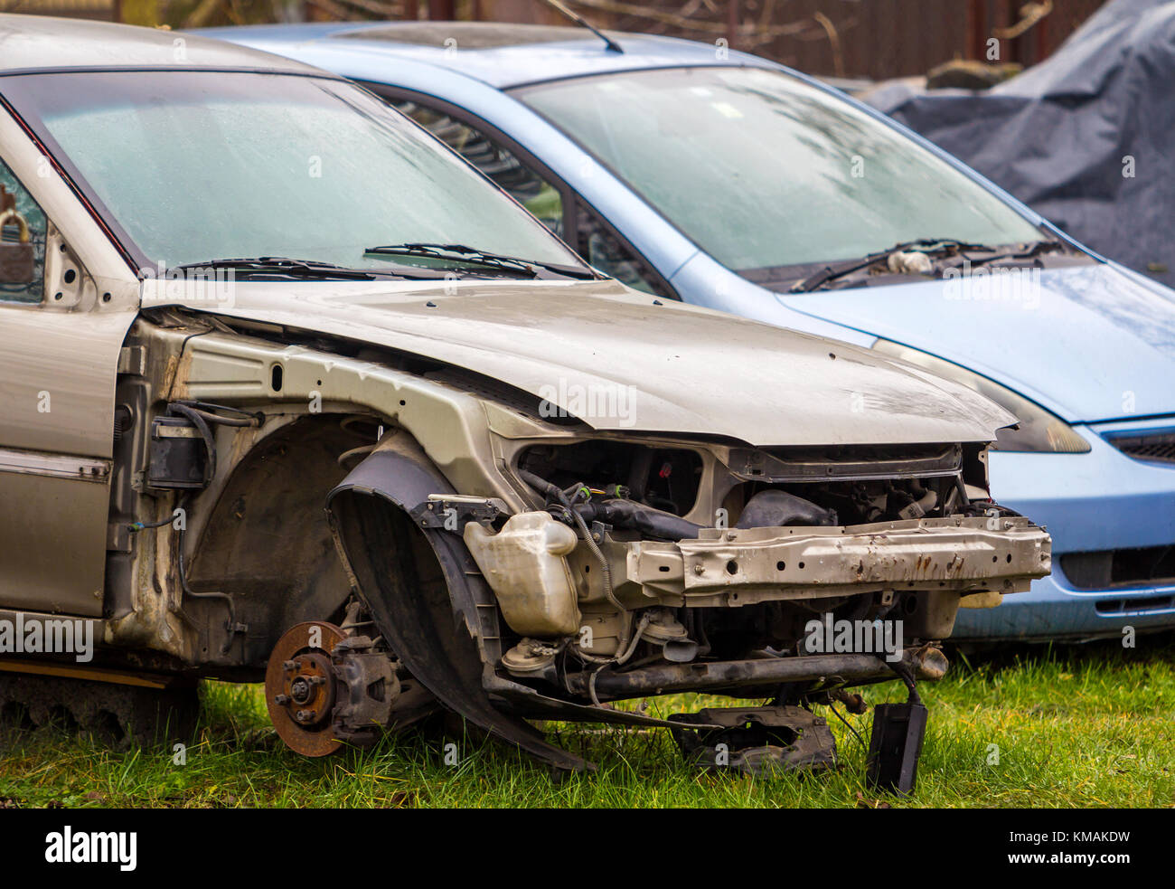 Badly damaged rusted car after road accident Stock Photo - Alamy