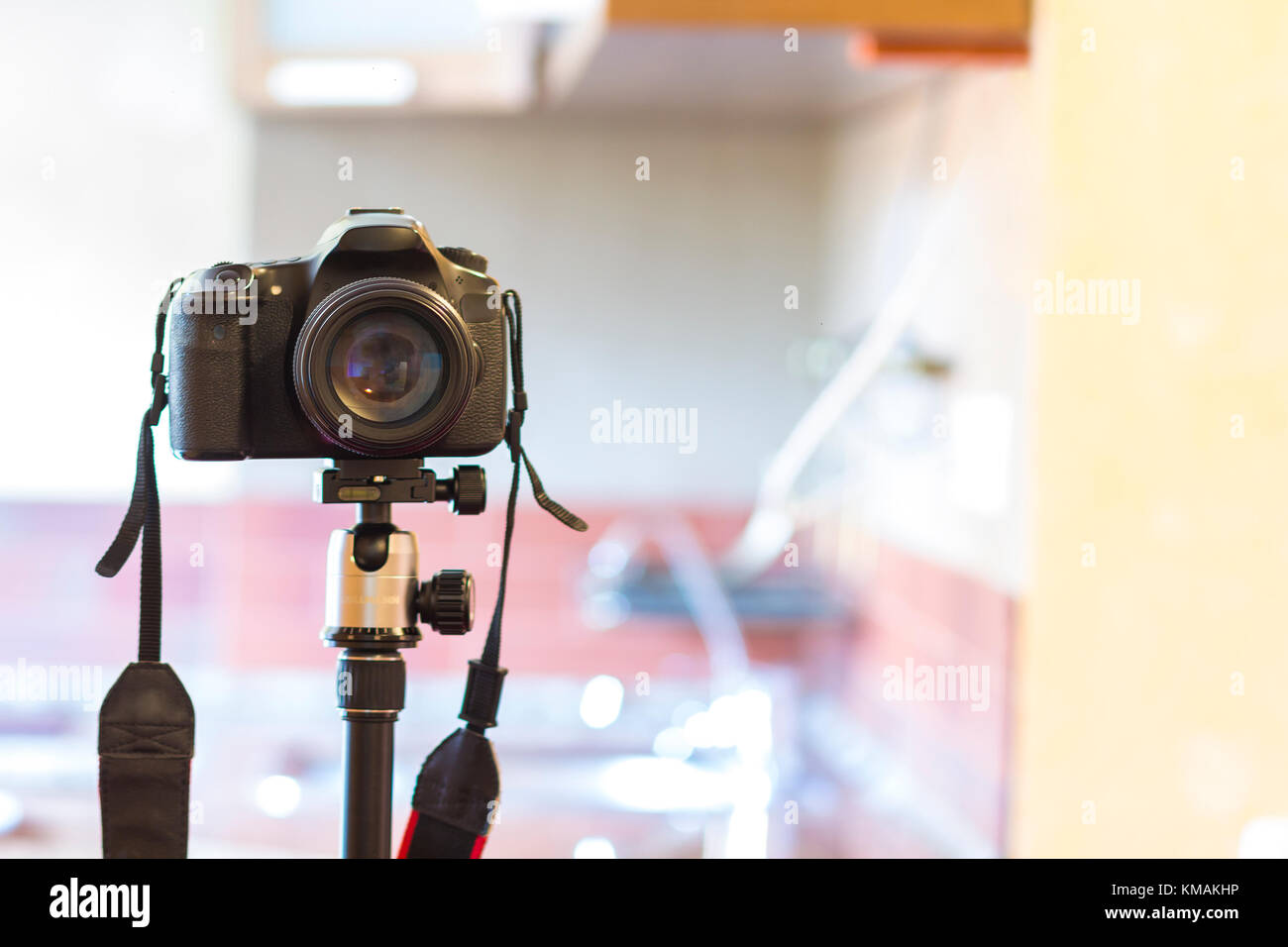 Photo digital camera with a big lens on a tripod Stock Photo - Alamy