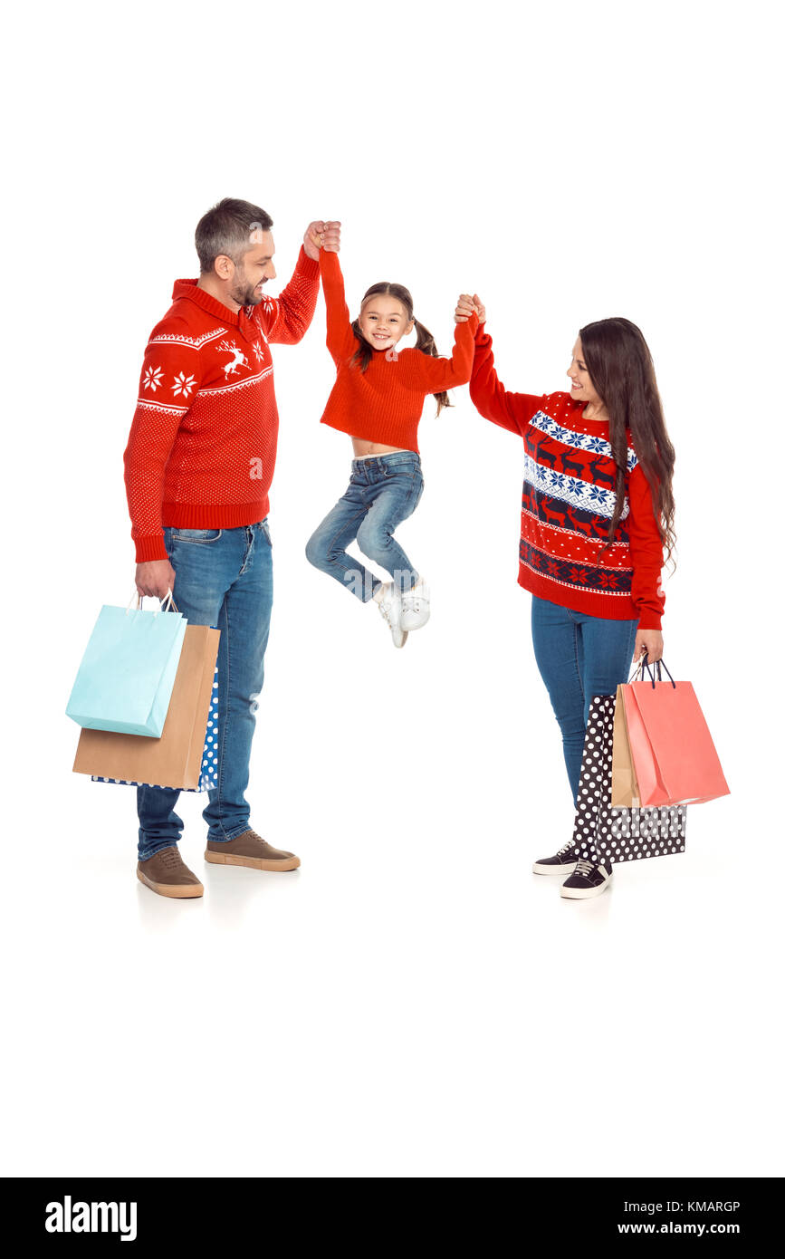 parents and daughter with shopping bags Stock Photo - Alamy