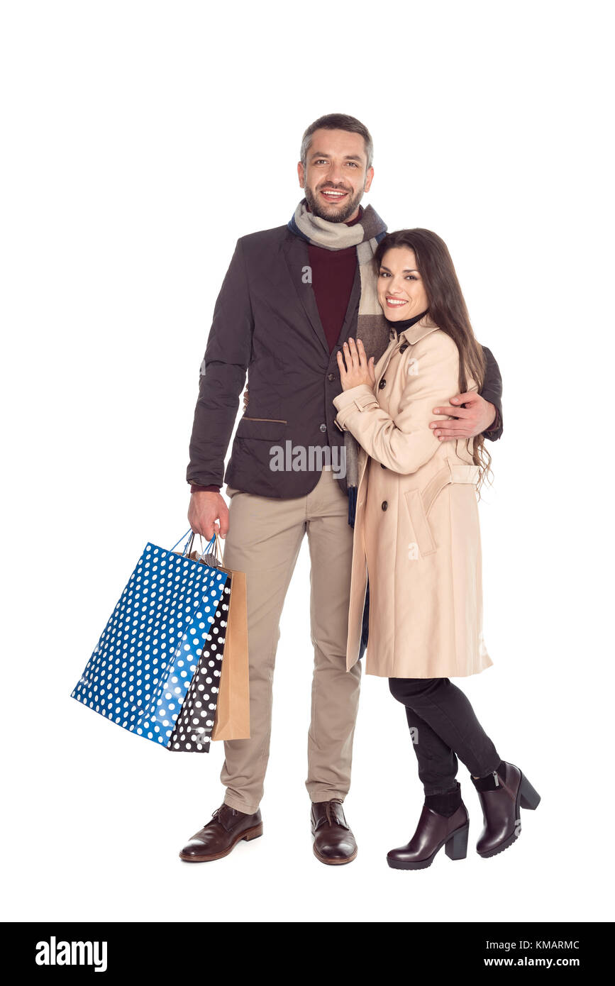 hugging couple with shopping bags Stock Photo - Alamy