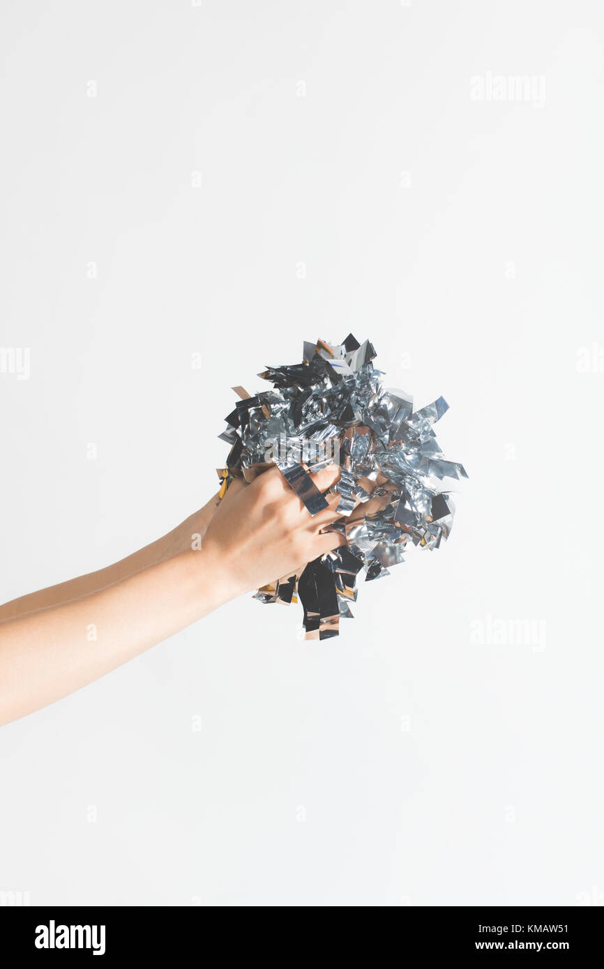 woman holding confetti in hands Stock Photo - Alamy