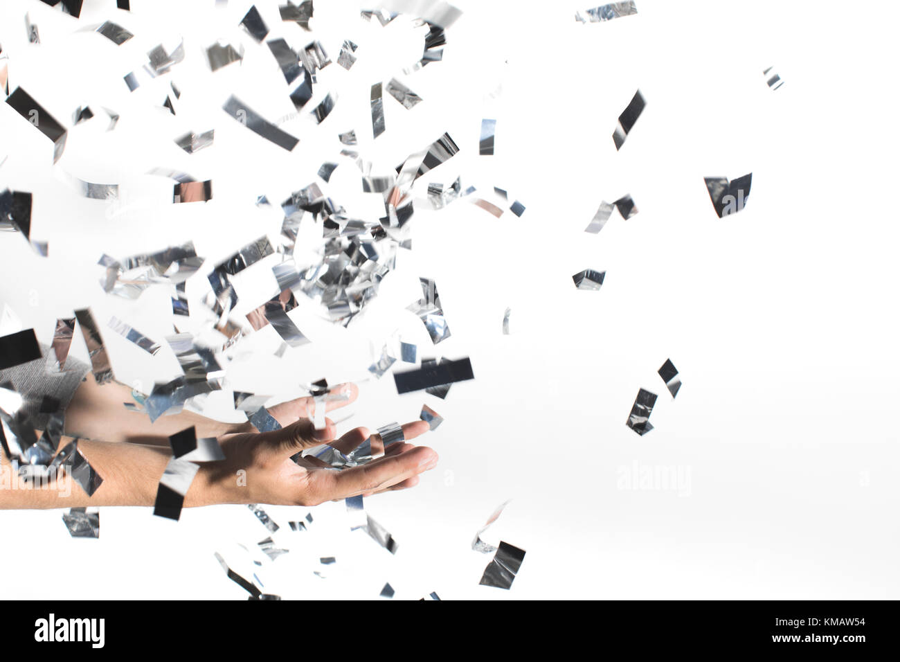 woman catching falling confetti Stock Photo - Alamy