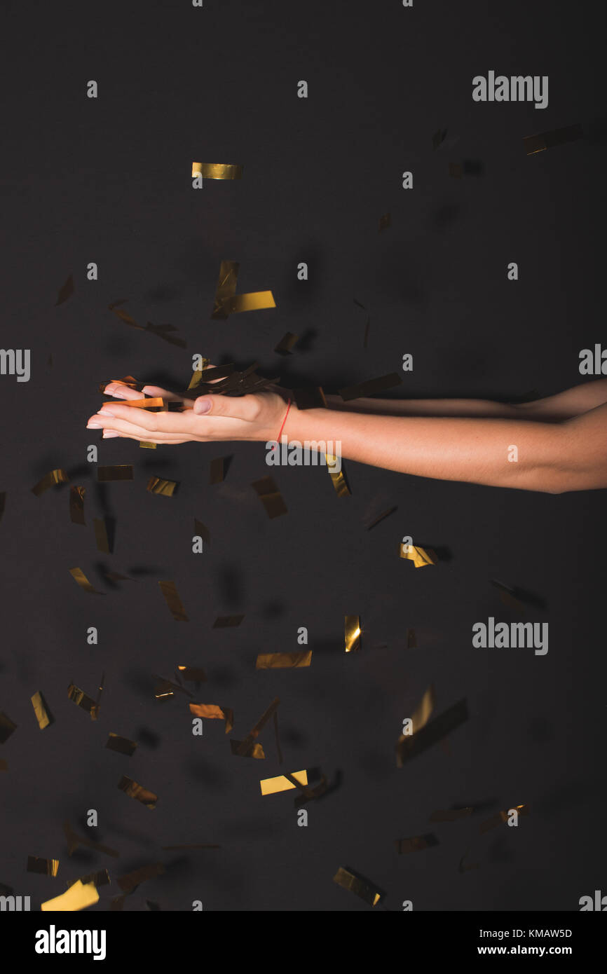 woman catching falling confetti Stock Photo - Alamy