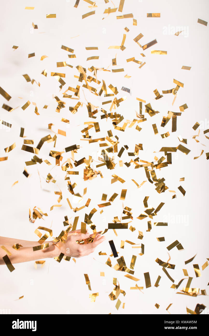 woman catching falling confetti Stock Photo - Alamy