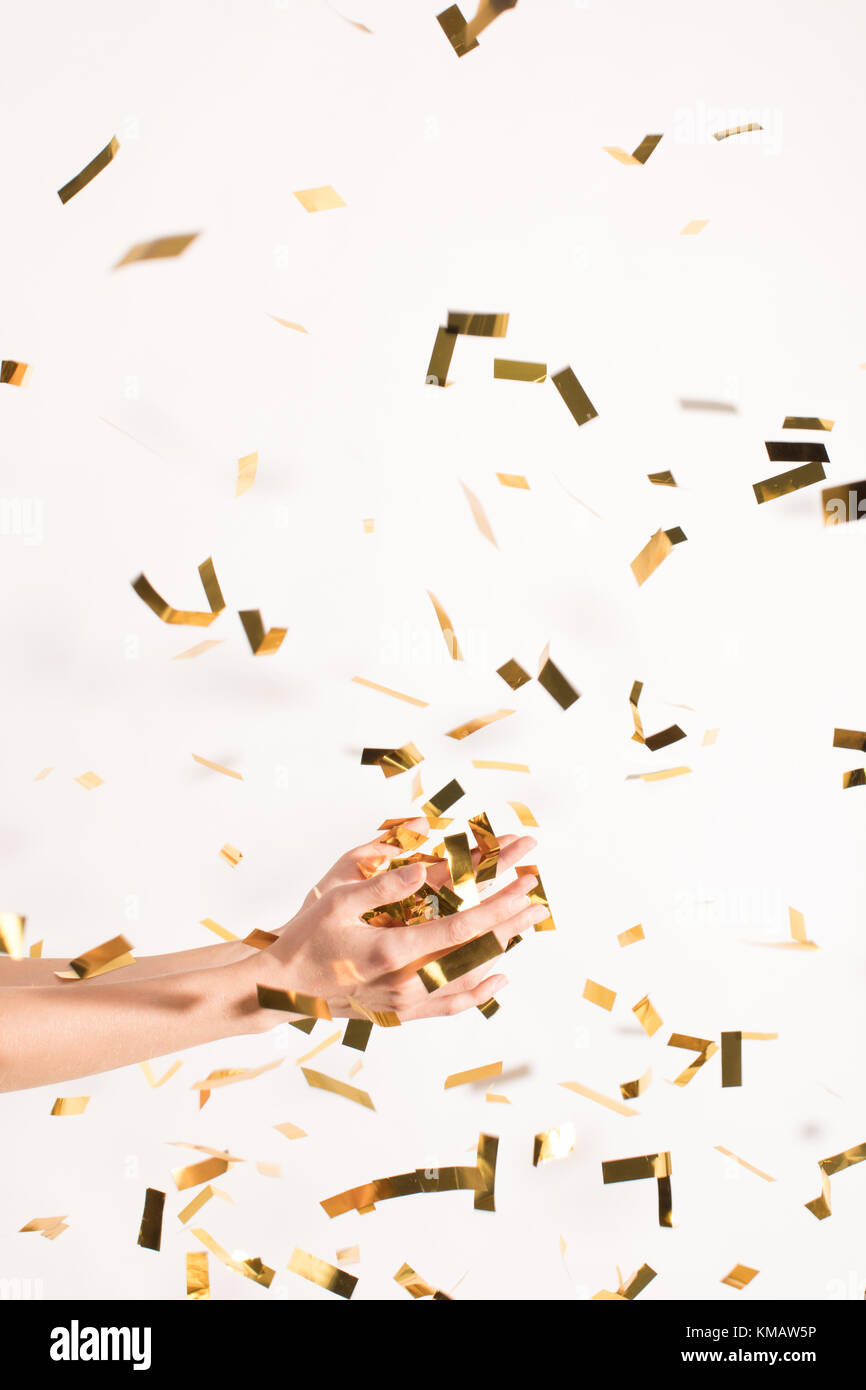 woman catching falling confetti Stock Photo - Alamy