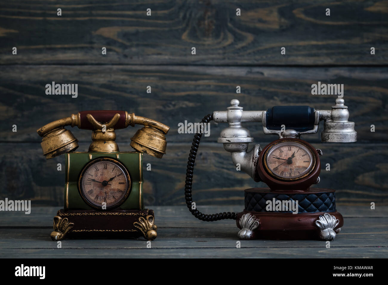 Desk clocks with antique telephone design on blue background Stock ...