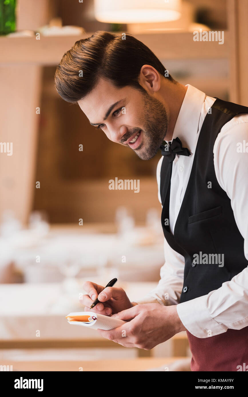 waiter writing down the order Stock Photo - Alamy