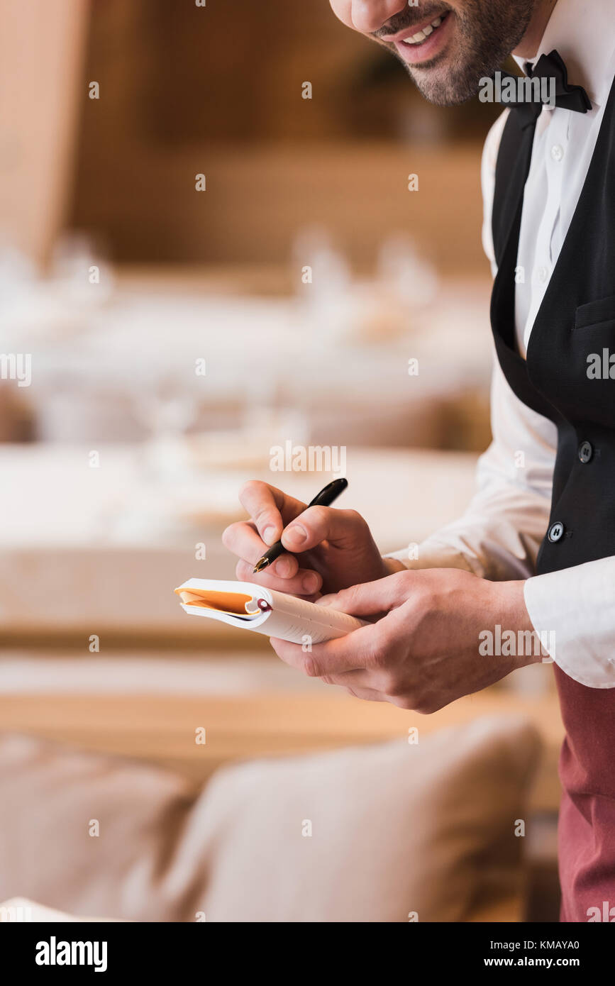 waiter writing down the order Stock Photo - Alamy