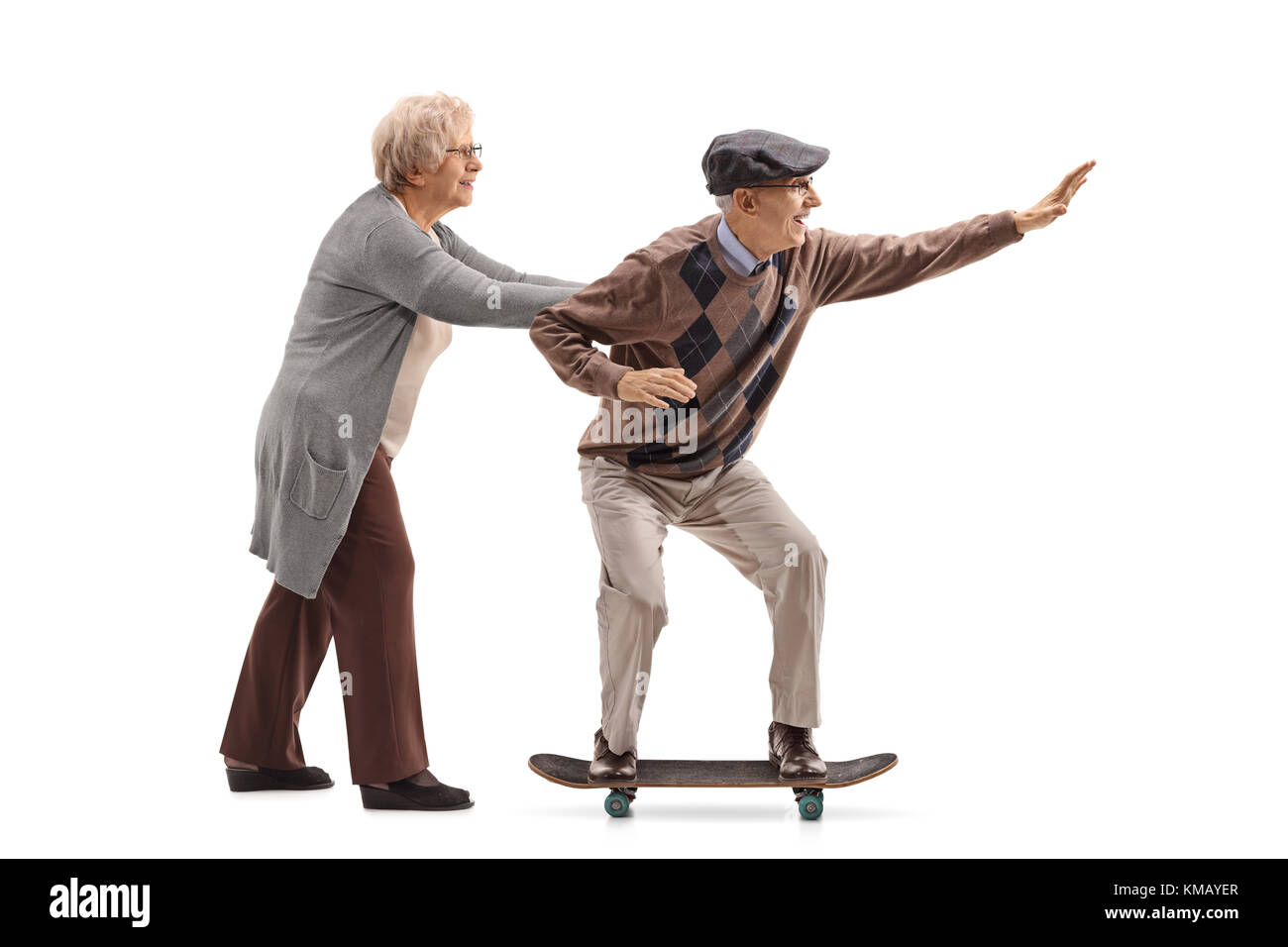 Full length profile shot of an elderly woman pushing an elderly man on ...